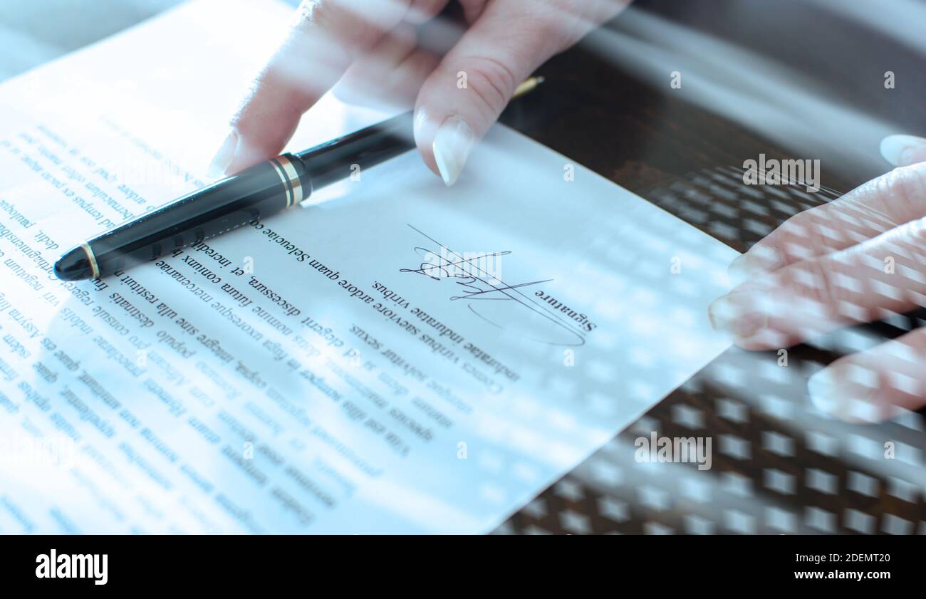 Contract signed, closeup; light effect Stock Photo - Alamy