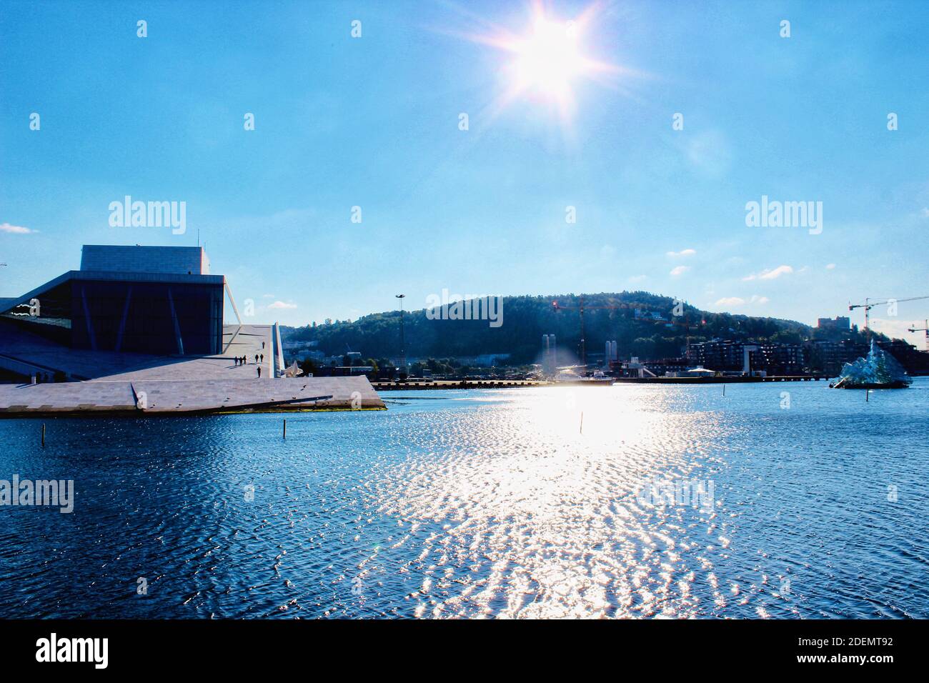 Intense sun reflection in water next to Oslo Opera House Stock Photo ...