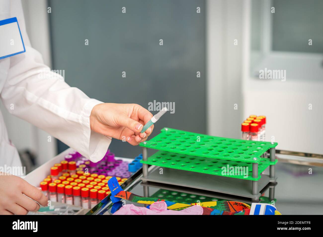 Female doctor's hands prepare tools for blood sampling in the lab Stock ...