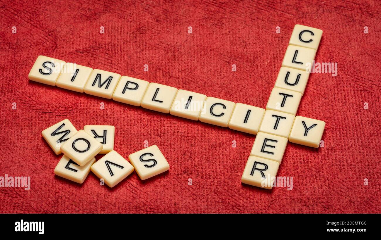 simplicity and clutter crossword in ivory letter tiles against textured ...