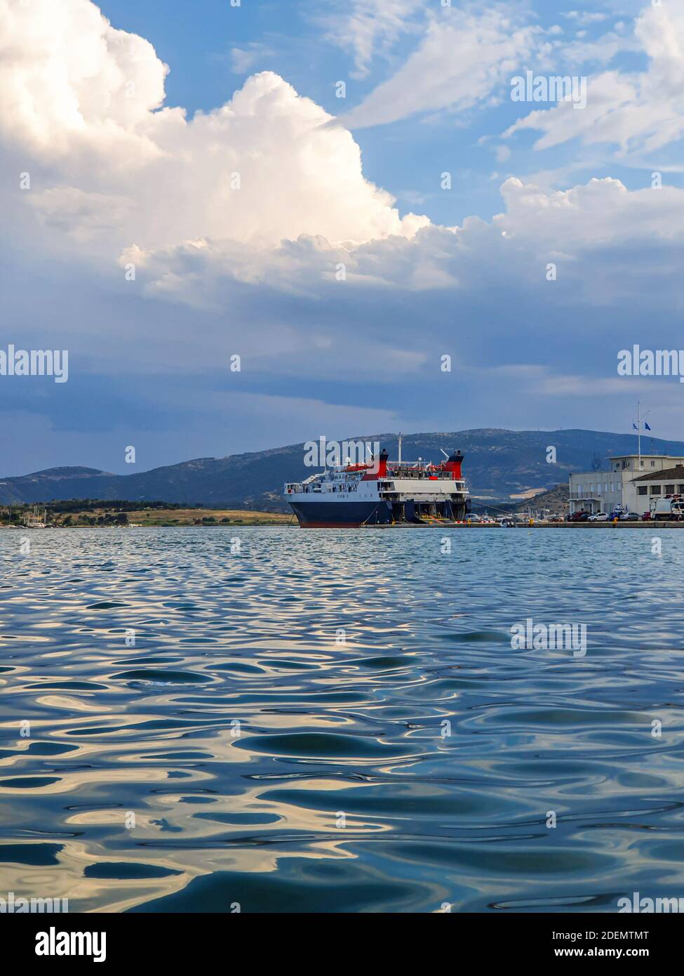 Big white ship. Ferry for passengers and vehicles. Loading cars and ...