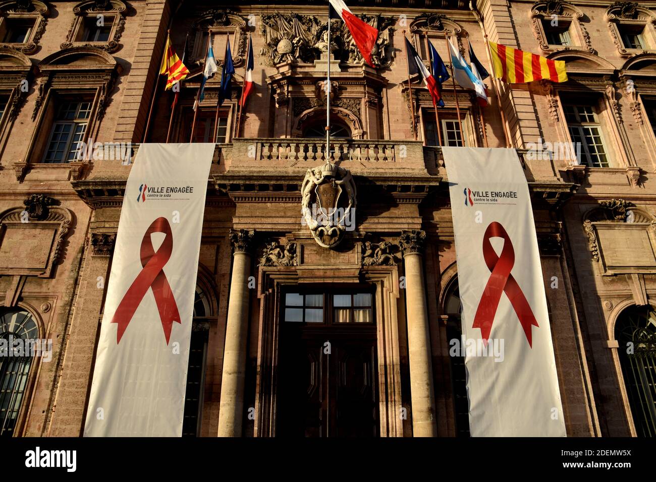 A close-up view of two banners with Red Ribbons (recognized symbols for ...