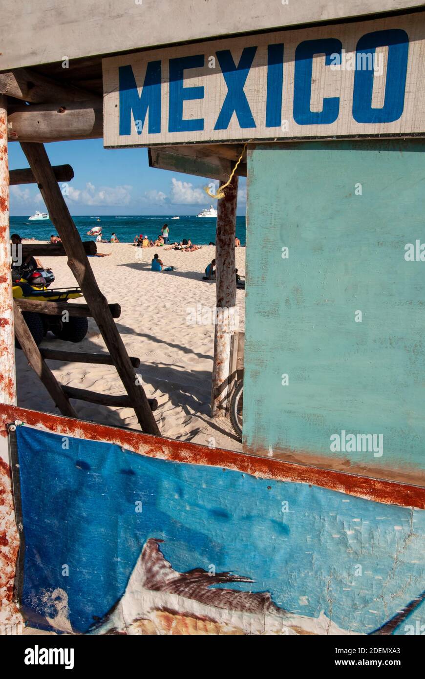 Old wooden sign with Mexico written on a public beach in Playa del ...