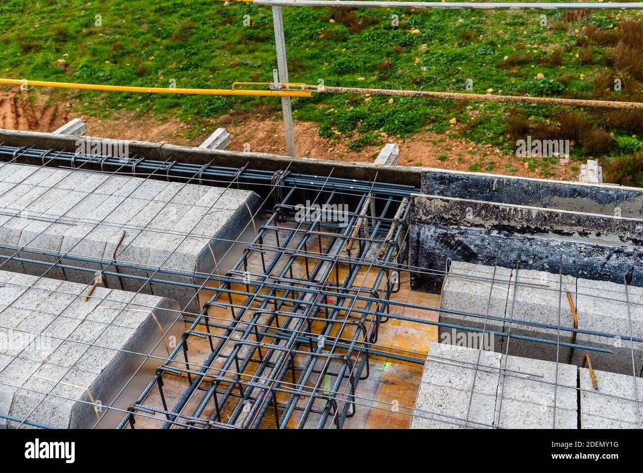 Construction site with steel formworks and reinforcing bars for pillars ...