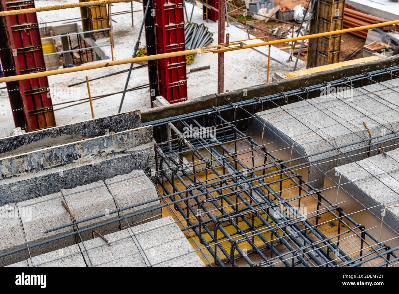 Construction site with steel formworks and reinforcing bars for pillars ...