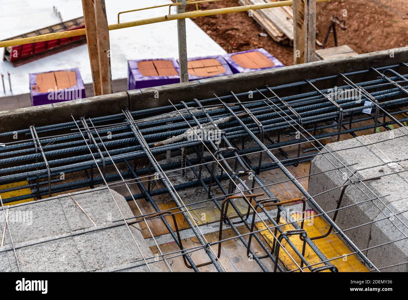 Construction site with steel formworks and reinforcing bars for pillars ...