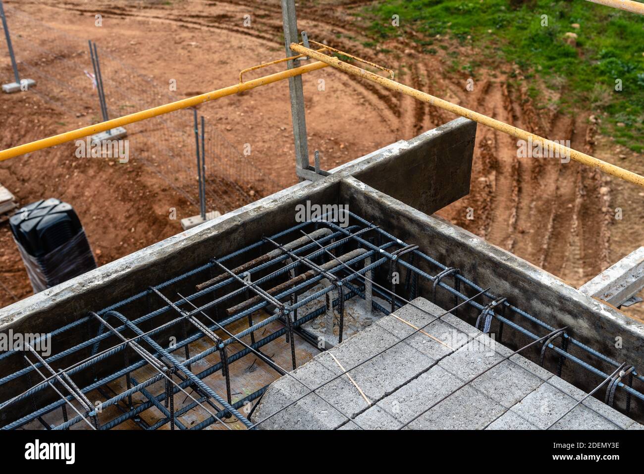 Construction site with steel formworks and reinforcing bars for pillars ...