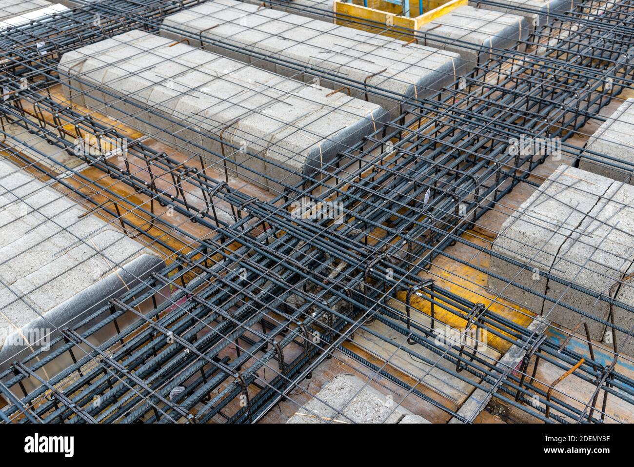 Construction site with steel formworks and reinforcing bars for pillars ...