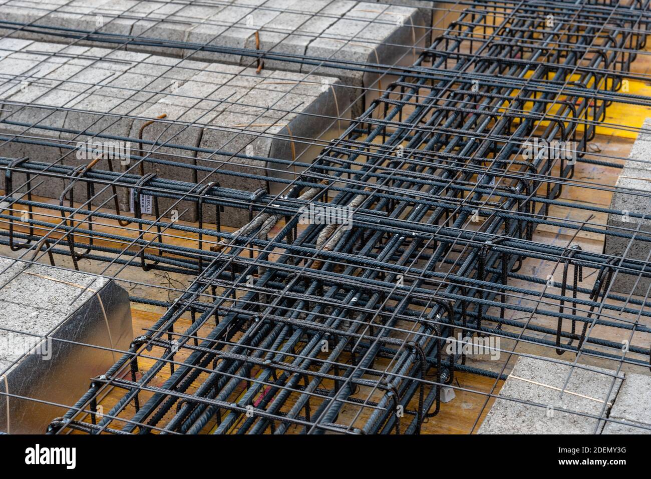 Construction site with steel formworks and reinforcing bars for pillars ...