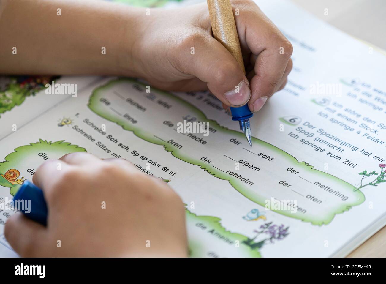 German boy learns at home with his mother - booklet with german words ...