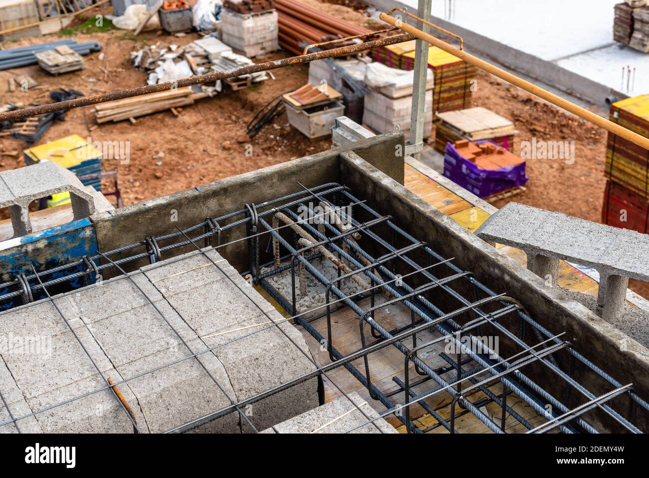 Construction site with steel formworks and reinforcing bars for pillars ...