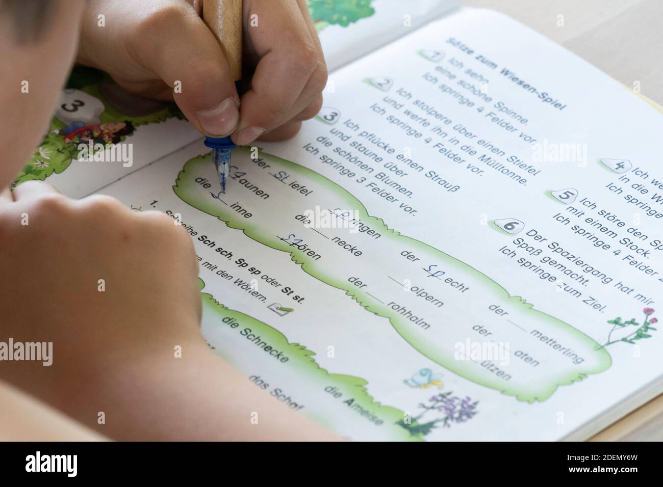 German boy learns at home with his mother - booklet with german words ...