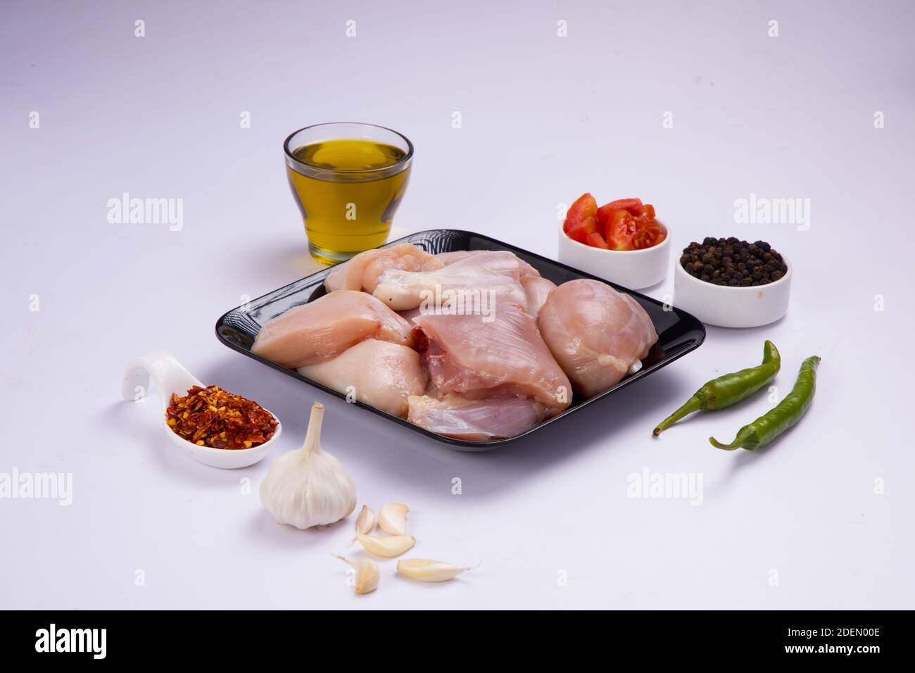 Raw chicken tender curry cut without skin arranged on wooden board and ...