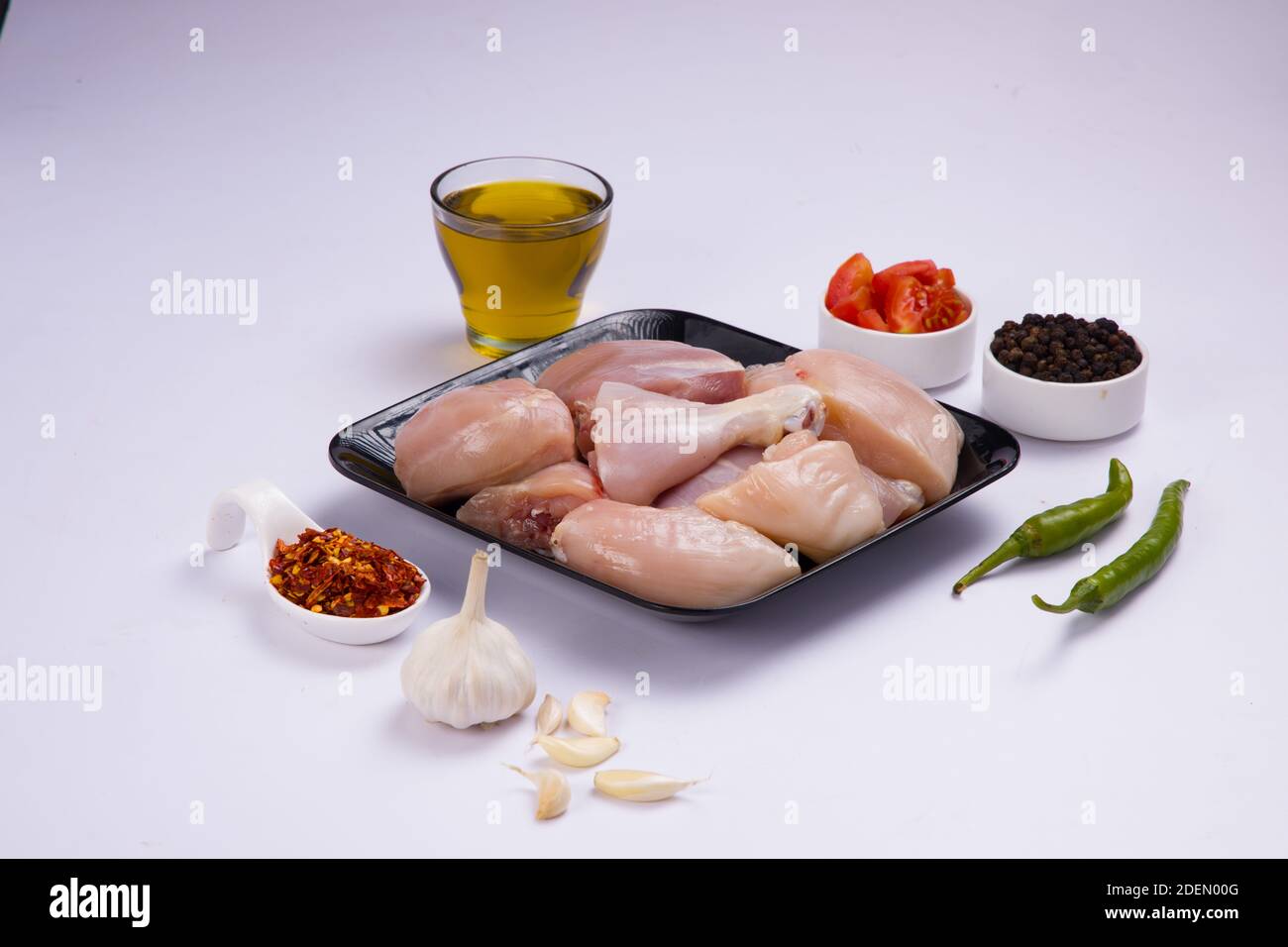 Raw chicken tender curry cut without skin arranged on wooden board and ...