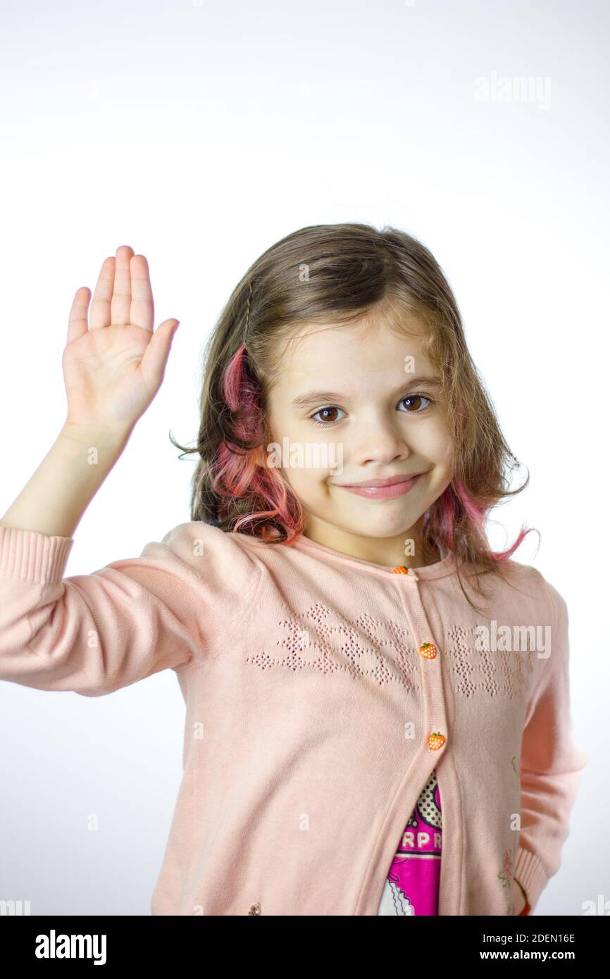 Little kid girl taking five with the arm Stock Photo - Alamy
