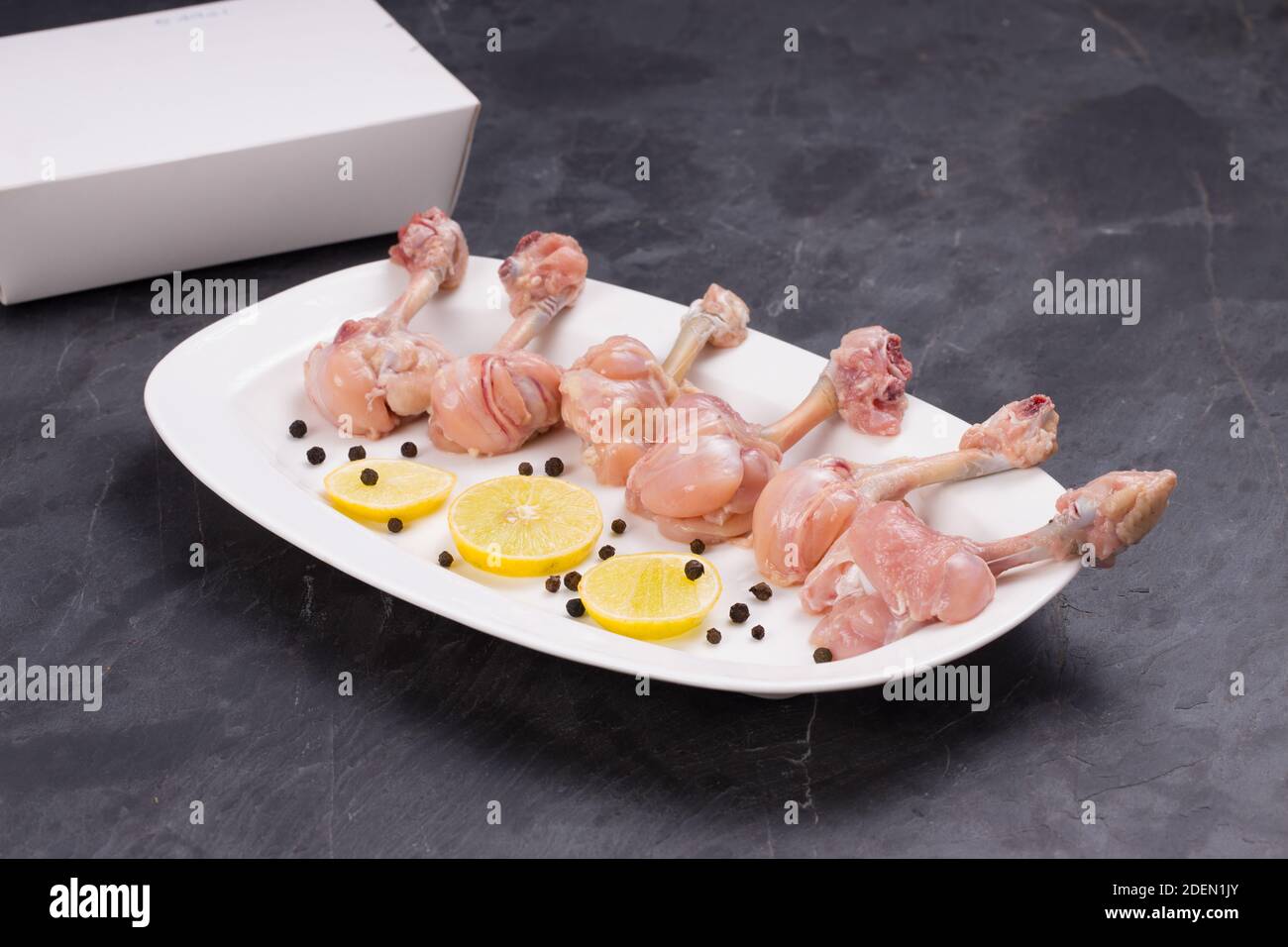 Raw chicken lollipop,six pieces of chicken lollipop arranged on a ...