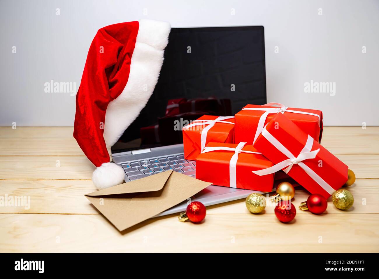 Christmas online shopping. Human doing the order on laptop computer ...