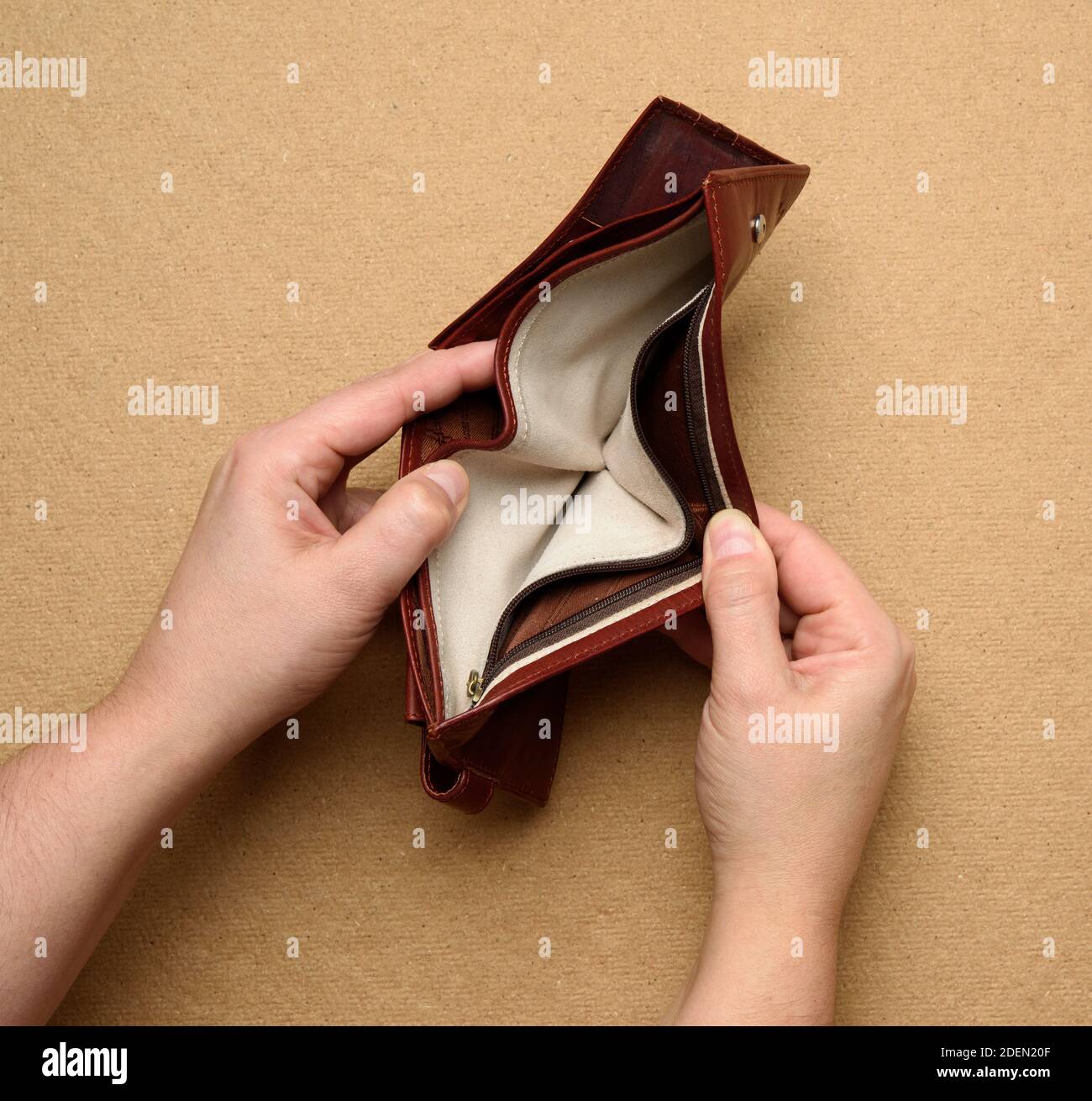 two female hands hold brown leather open empty wallet for cash, top ...