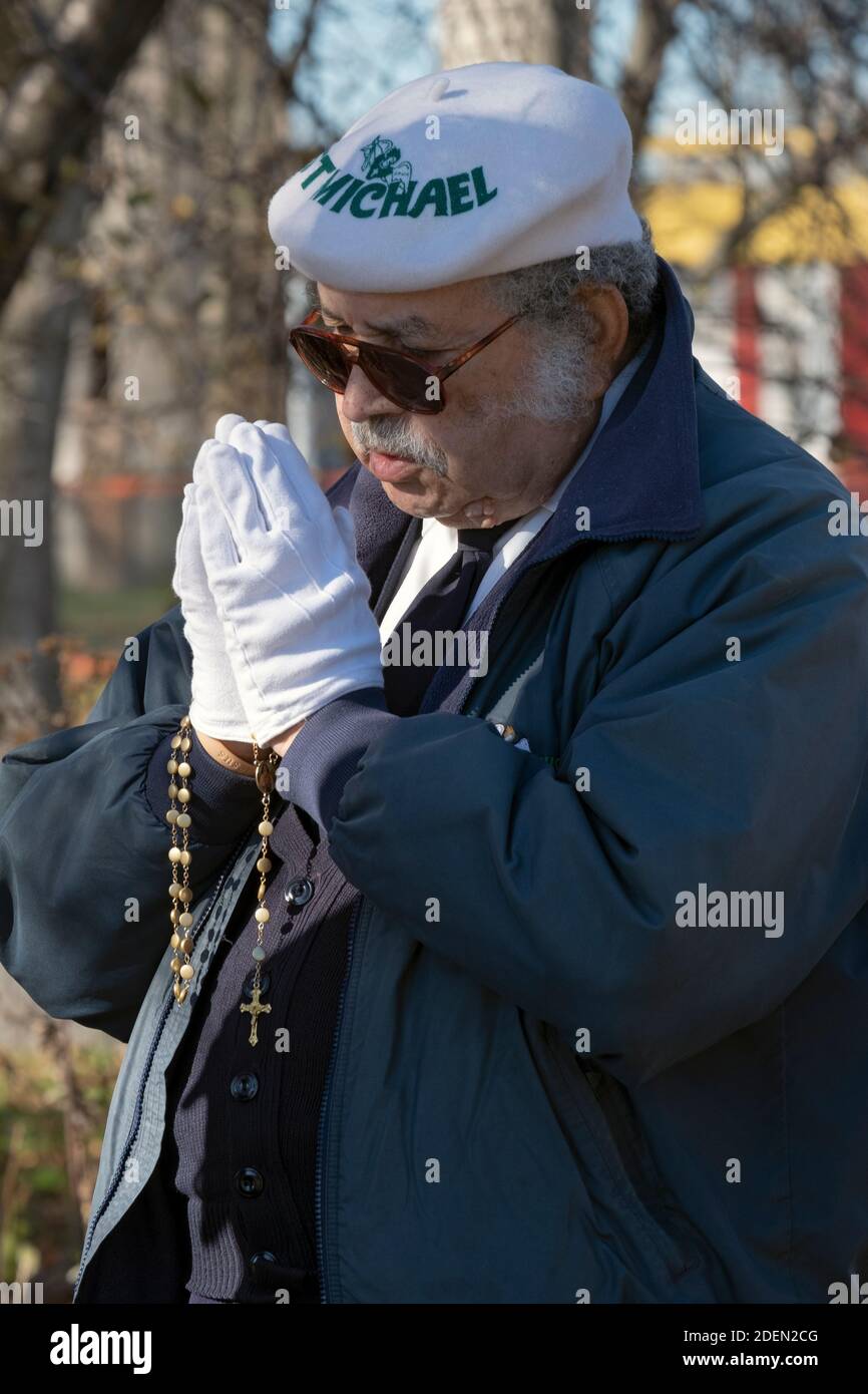 A devout Roman Catholic man prays at the Vatican Pavilion site in ...