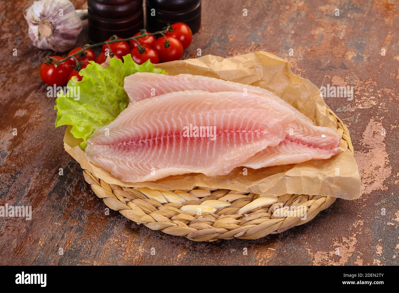Raw tilapia fish ready for cooking Stock Photo - Alamy
