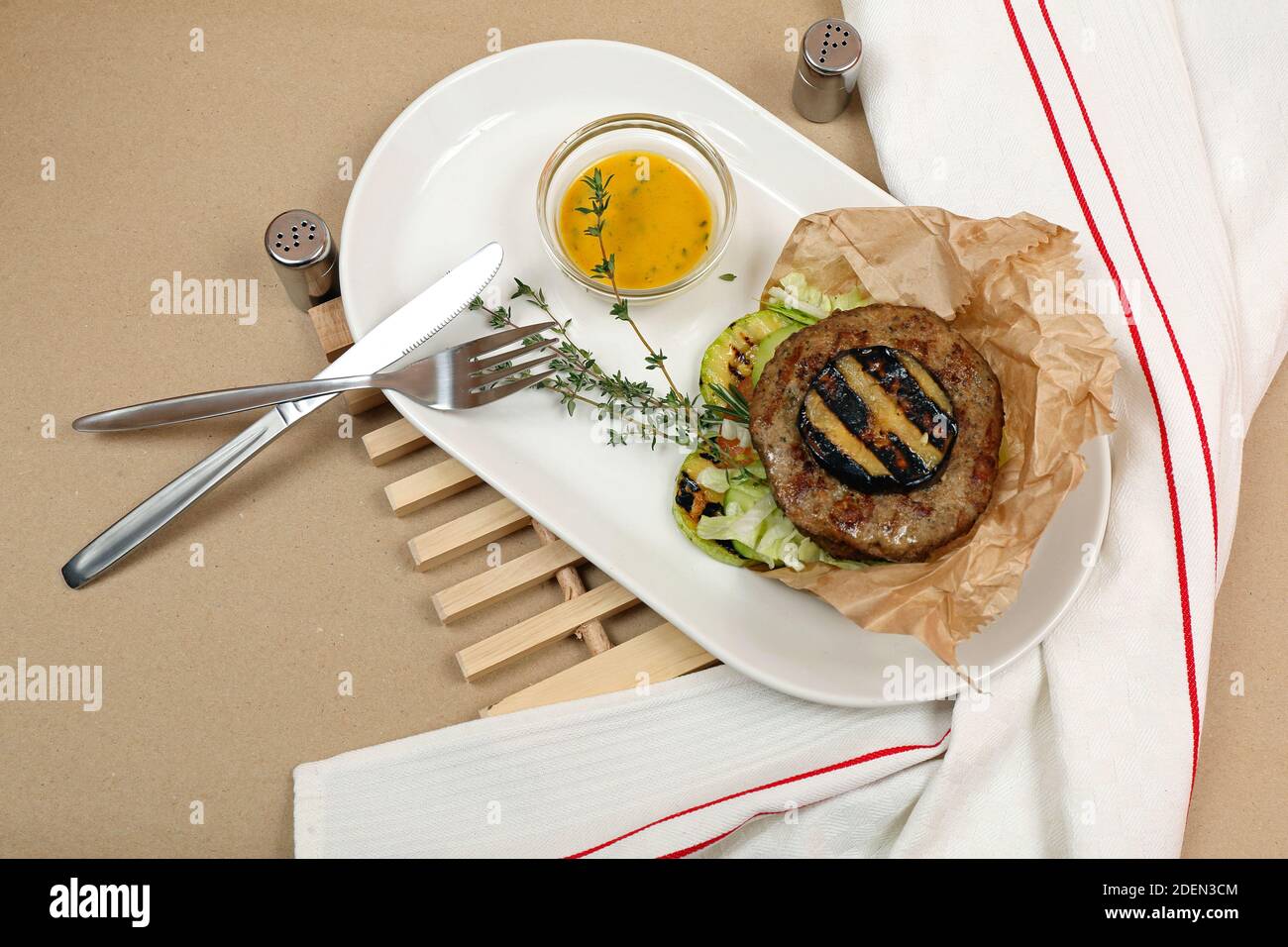 Vegan Burger With Sauce Served at Plate Top View Stock Photo - Alamy