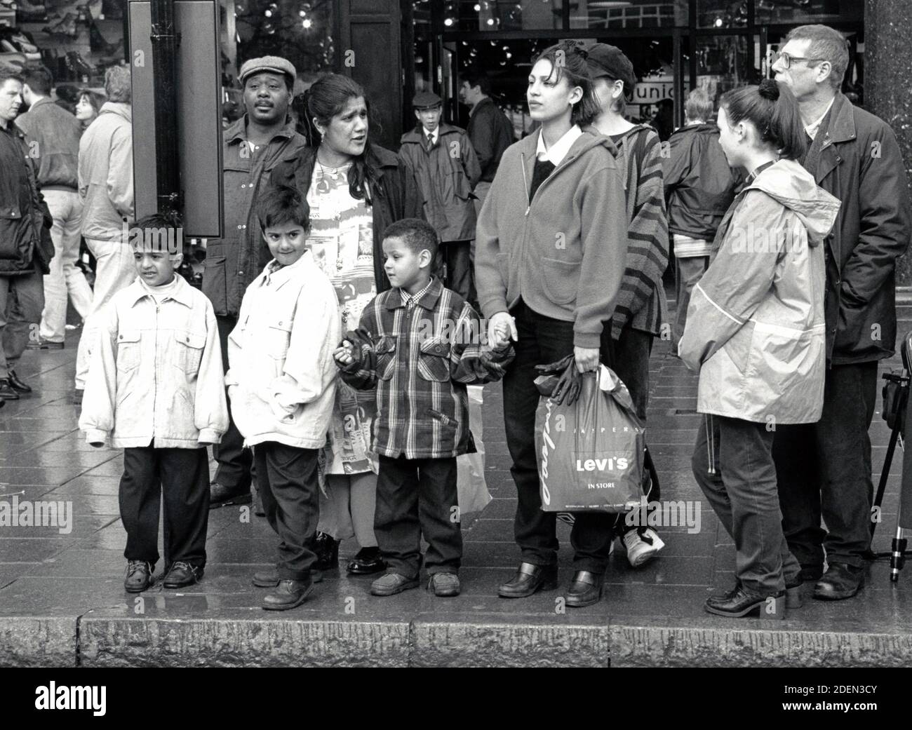Group of people at bus stop Nottingham UK 1990s Stock Photo - Alamy
