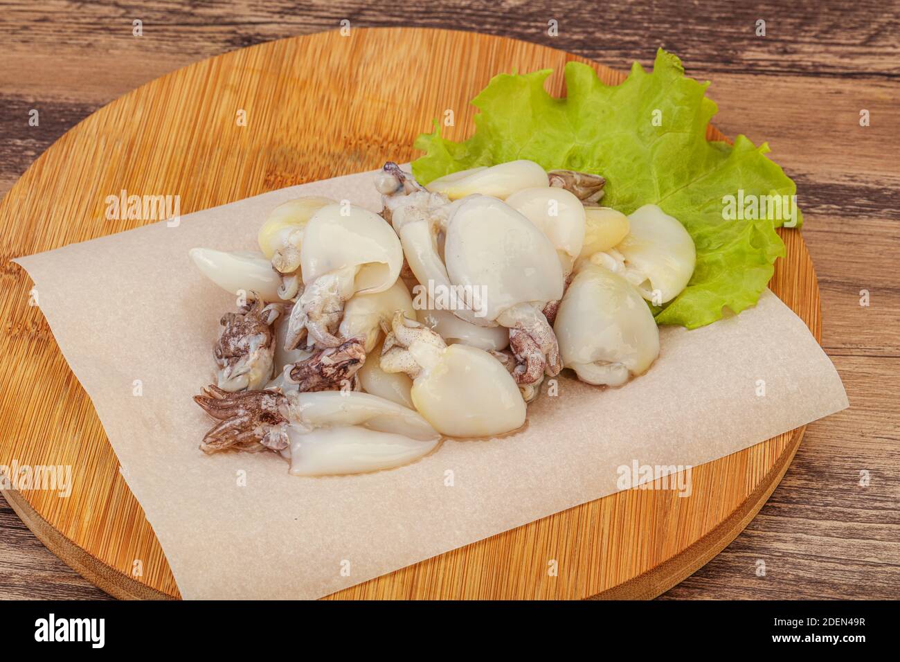 Raw seafood - cuttlefish for cooking over board Stock Photo - Alamy