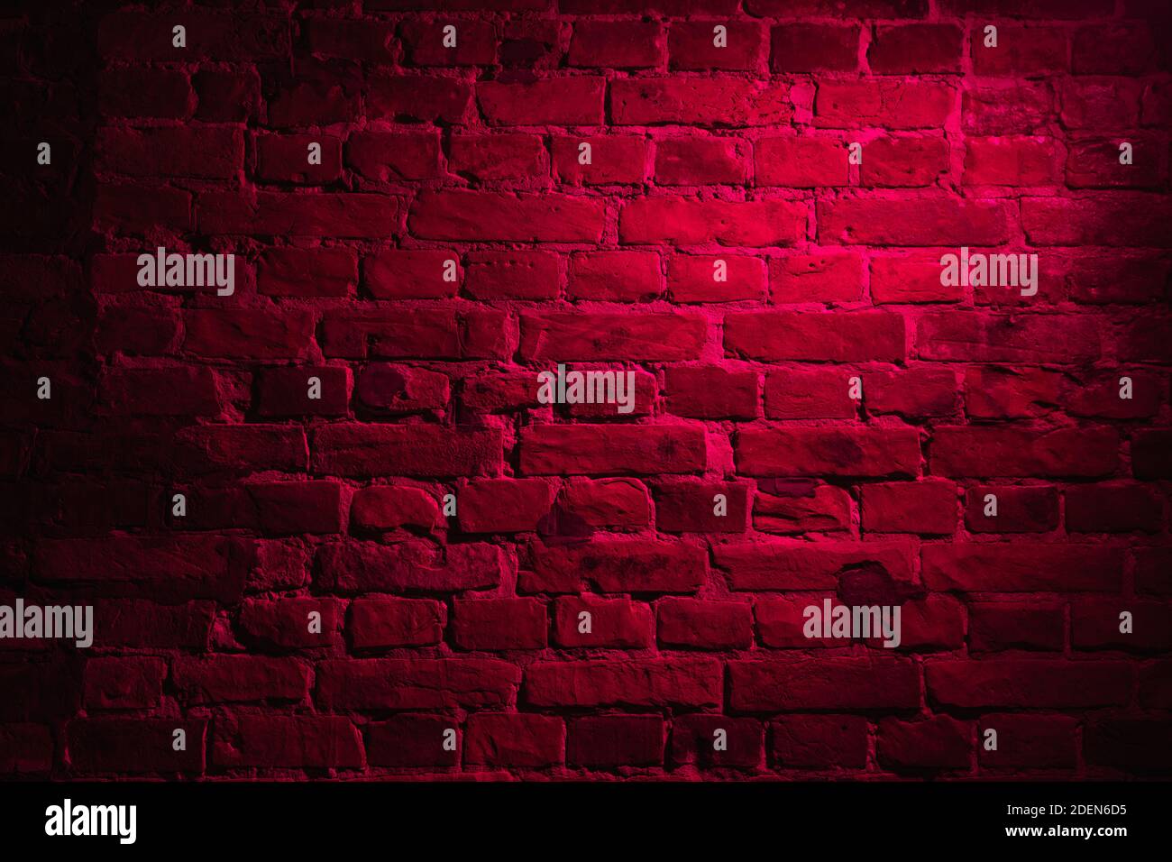 Old brick wall with bright red neon glow effect as background texture ...
