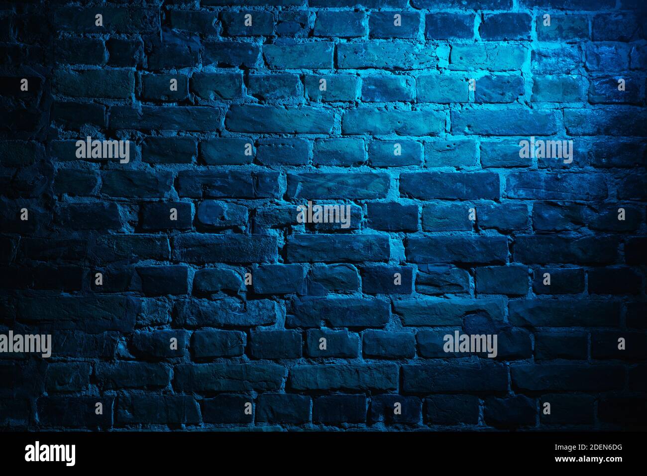 Empty brick wall with blue neon light background Stock Photo - Alamy
