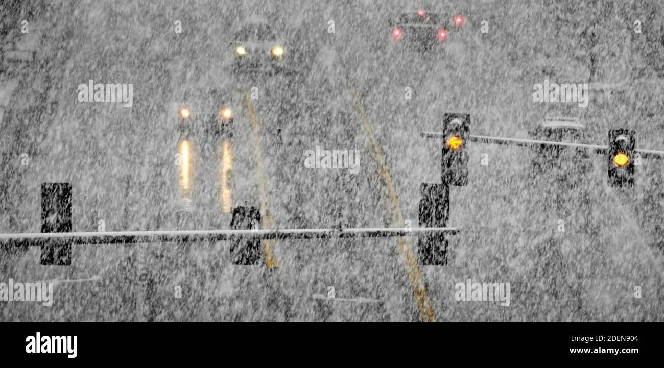 Driving on snow and snowy roads in winter traffic lights blizzard Stock ...