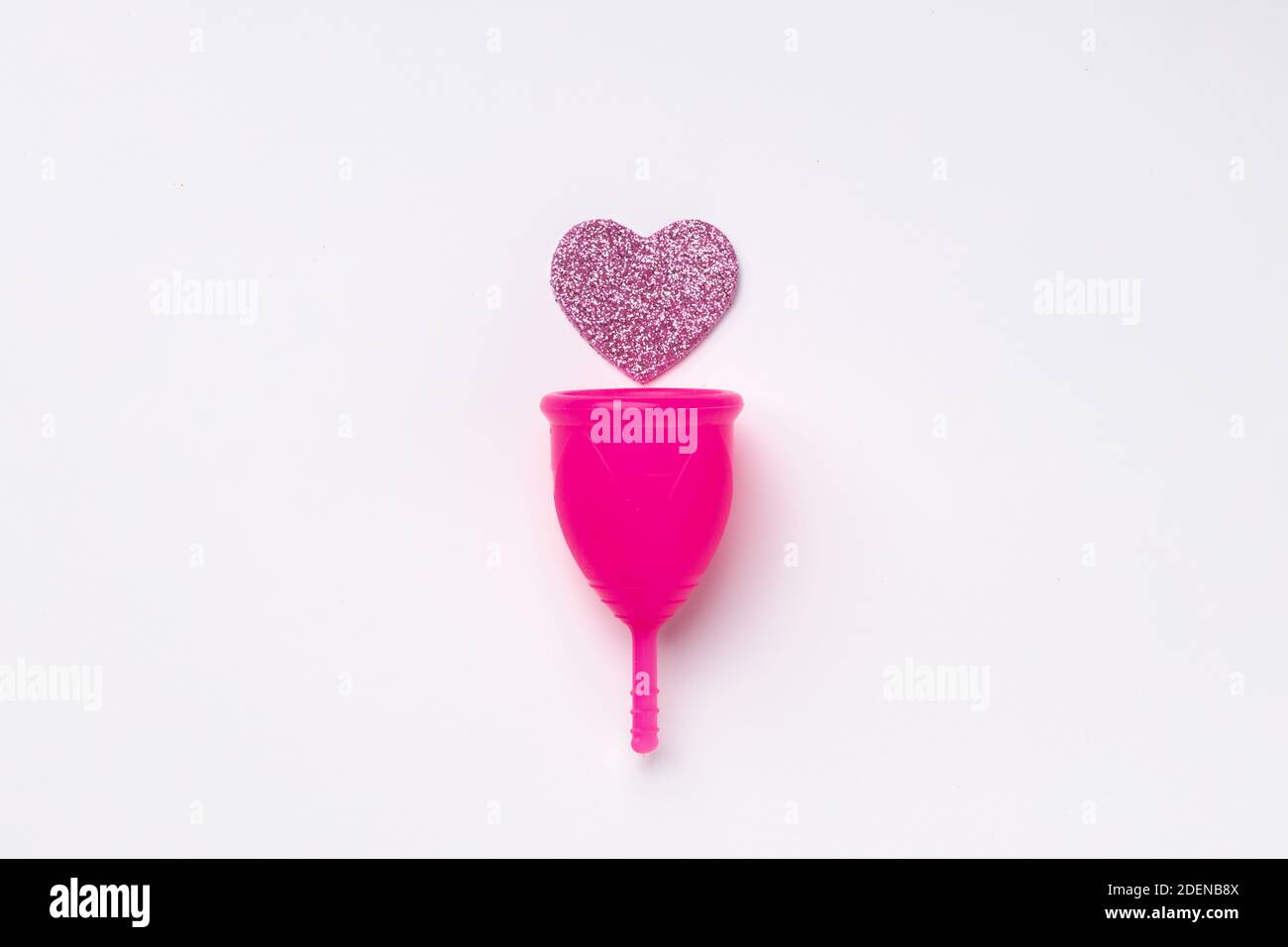 Pink silicone menstrual cup on white background Stock Photo - Alamy