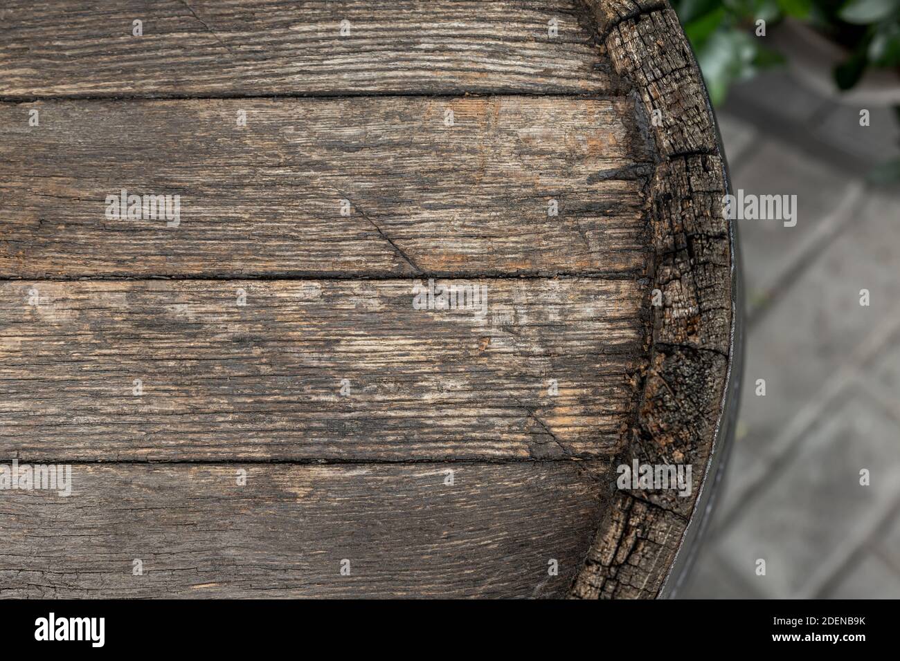Close-up background of top of old retro vintage weathered wooden cask ...