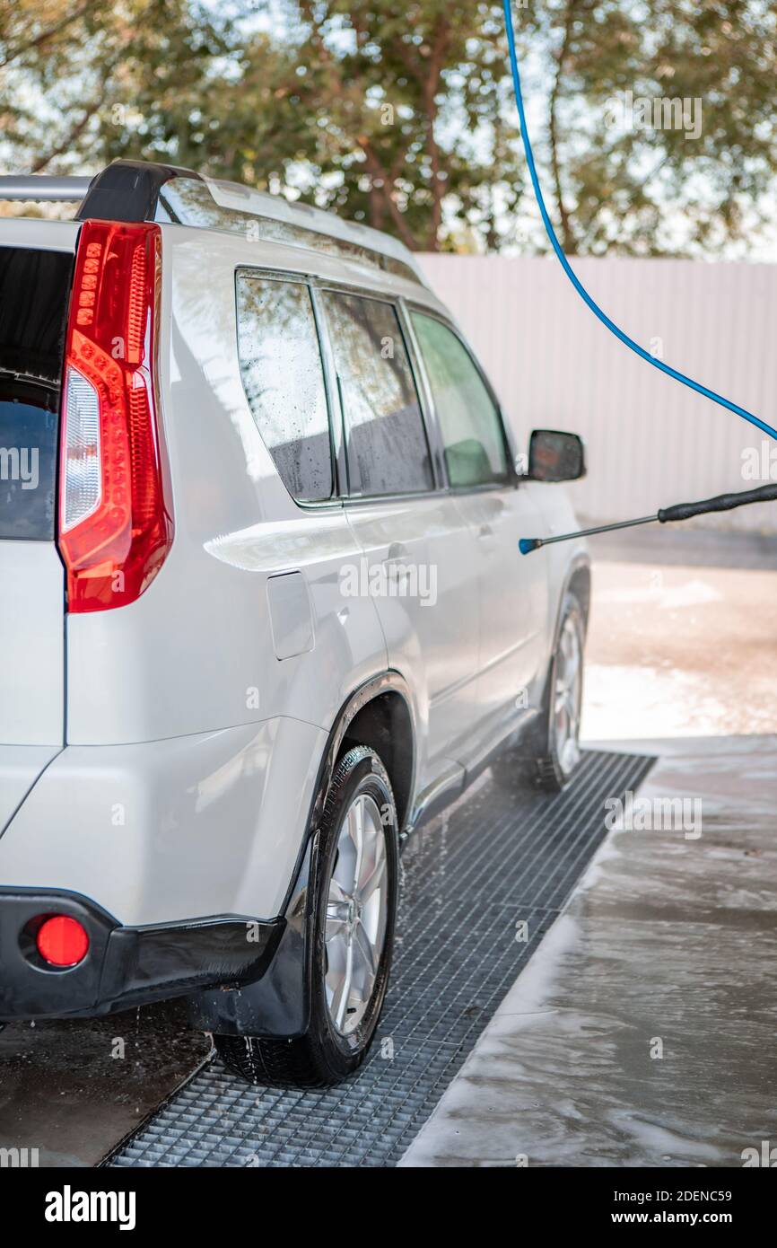 strong man washing car at self carwash outdoors summer time Stock Photo ...