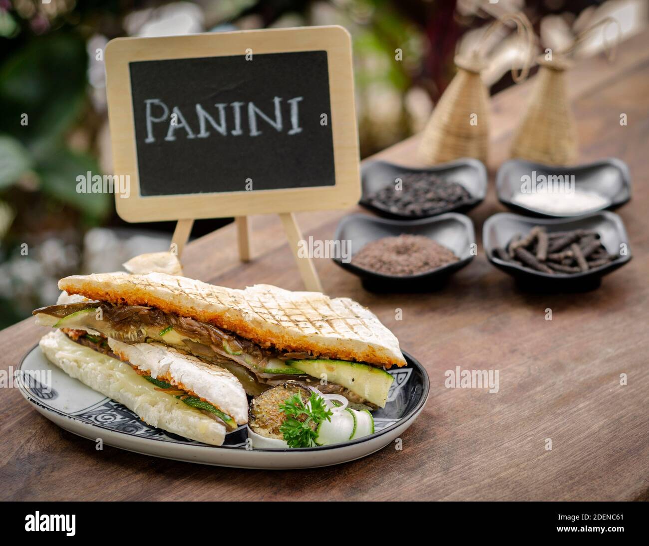 vegan roasted vegetable toasted panini sandwich in rustic garden table ...