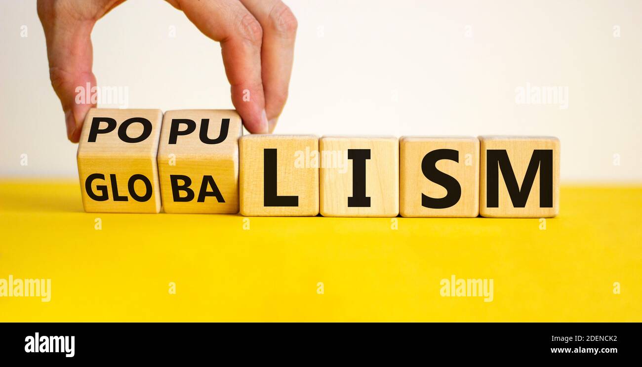 Populism or globalism. Hand turns cubes and changes word 'globalism' to ...