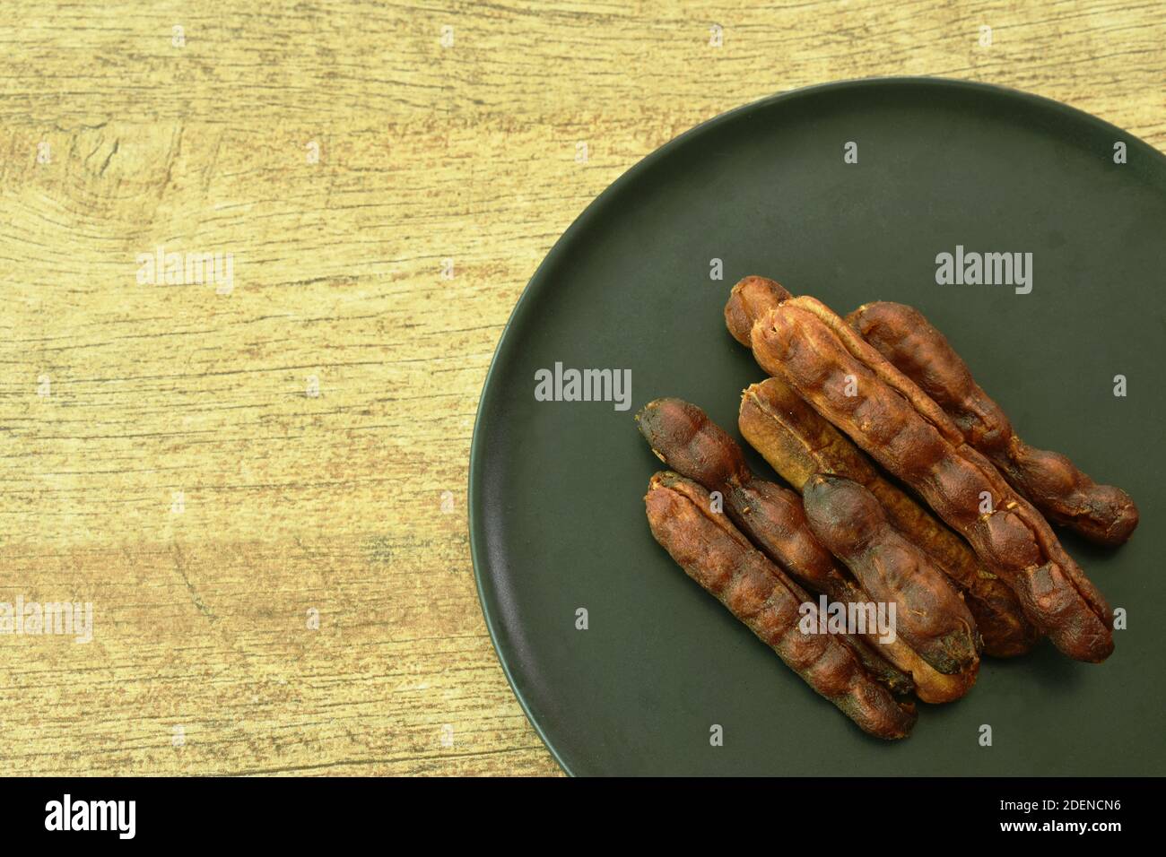 dry pickled tamarind taste sweet and sour Thai preserved food on plate ...