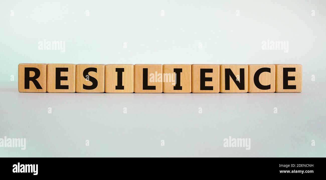 Resilience symbol. Wooden cubes with word 'resilience'. Beautiful white ...