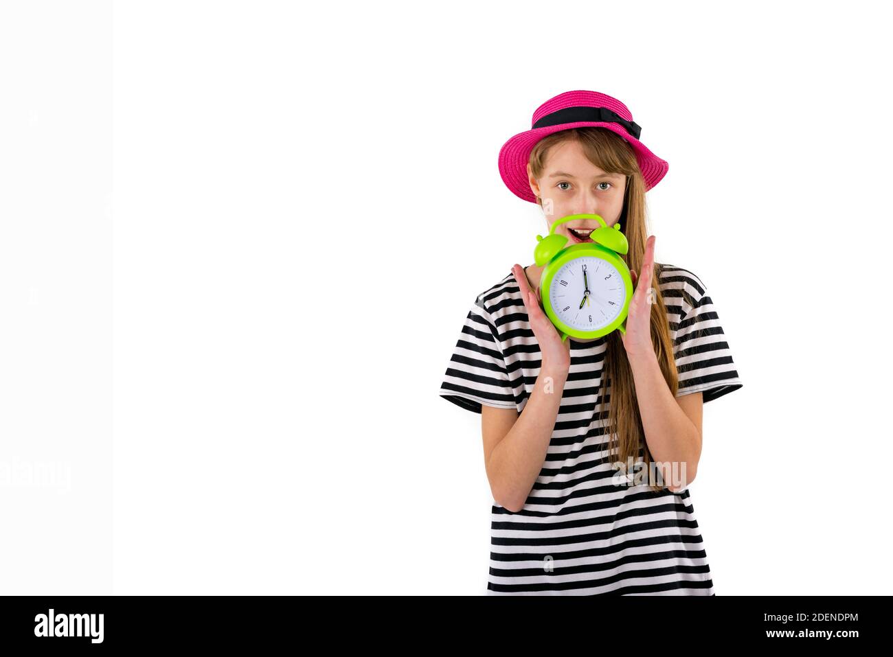 Surprised Girl holding alarm Clock, isolated on white background ...