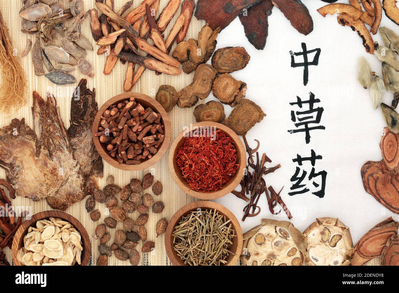 Traditional Chinese herbal medicine with herbs & calligraphy script on ...