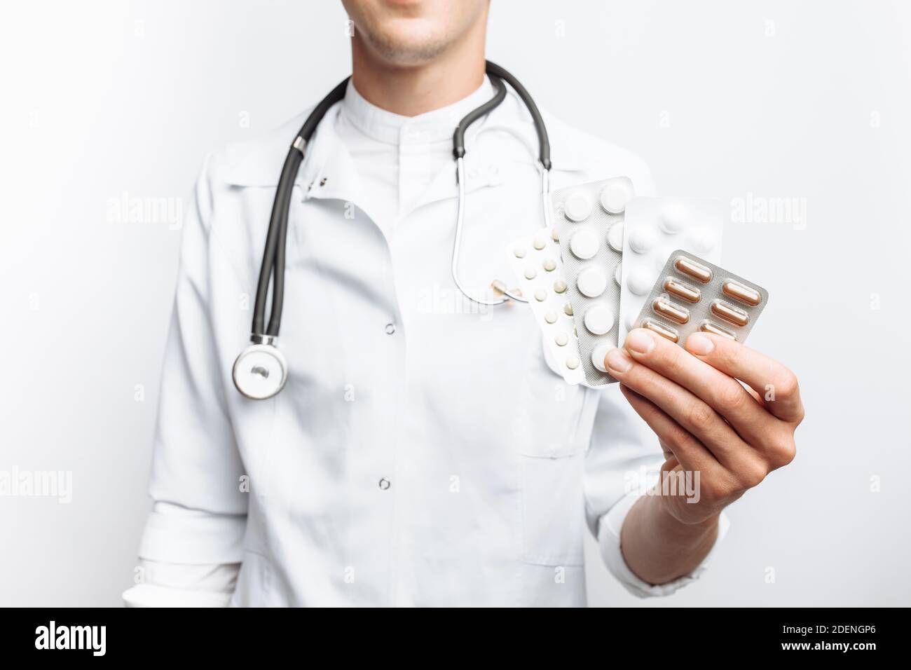 Hand doctor holding tablet, close-up, white background, for advertising ...