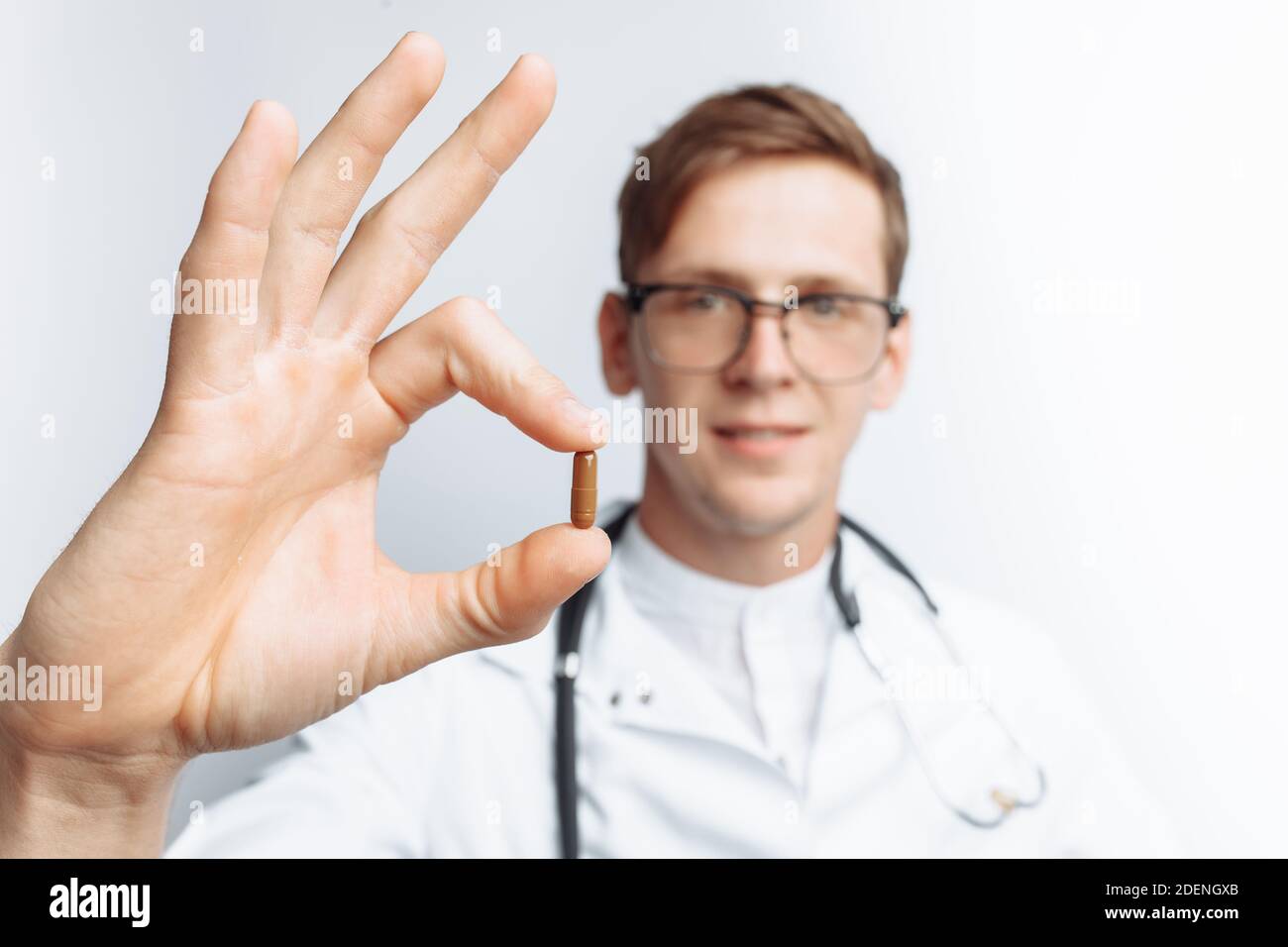 Hand doctor holding tablet, close-up, white background, for advertising ...