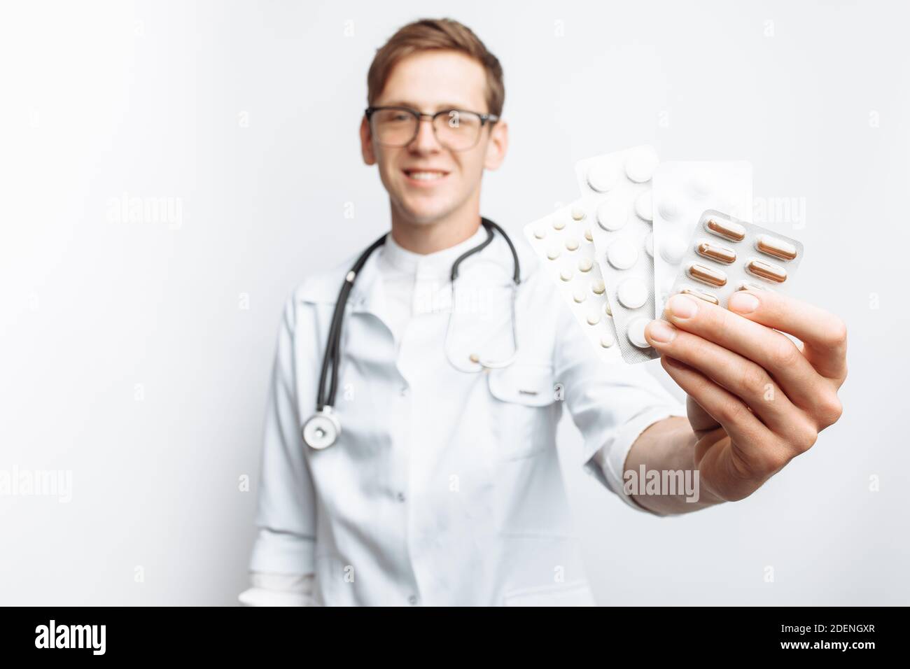 Hand doctor holding tablet, close-up, white background, for advertising ...