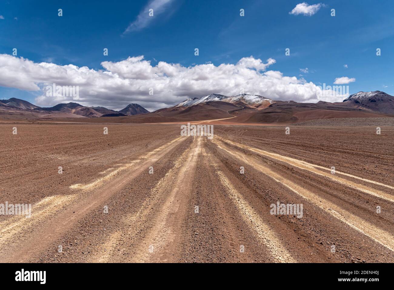 Snow mountains and empty road in the southwest of the the Andean ...