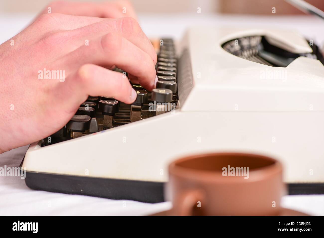 Hands typing retro writing machine. Old typewriter and authors hands ...