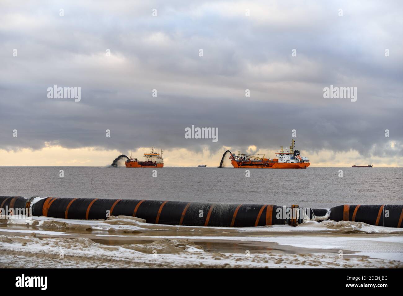 Two vessels engaged in dredging. Dredger working at sea. Ship ...