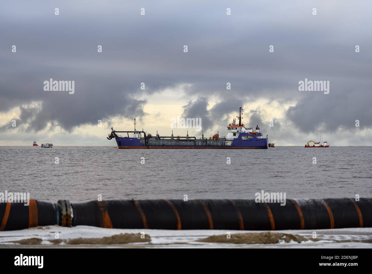 Vessel engaged in dredging. Dredger working at sea. Ship excavating ...