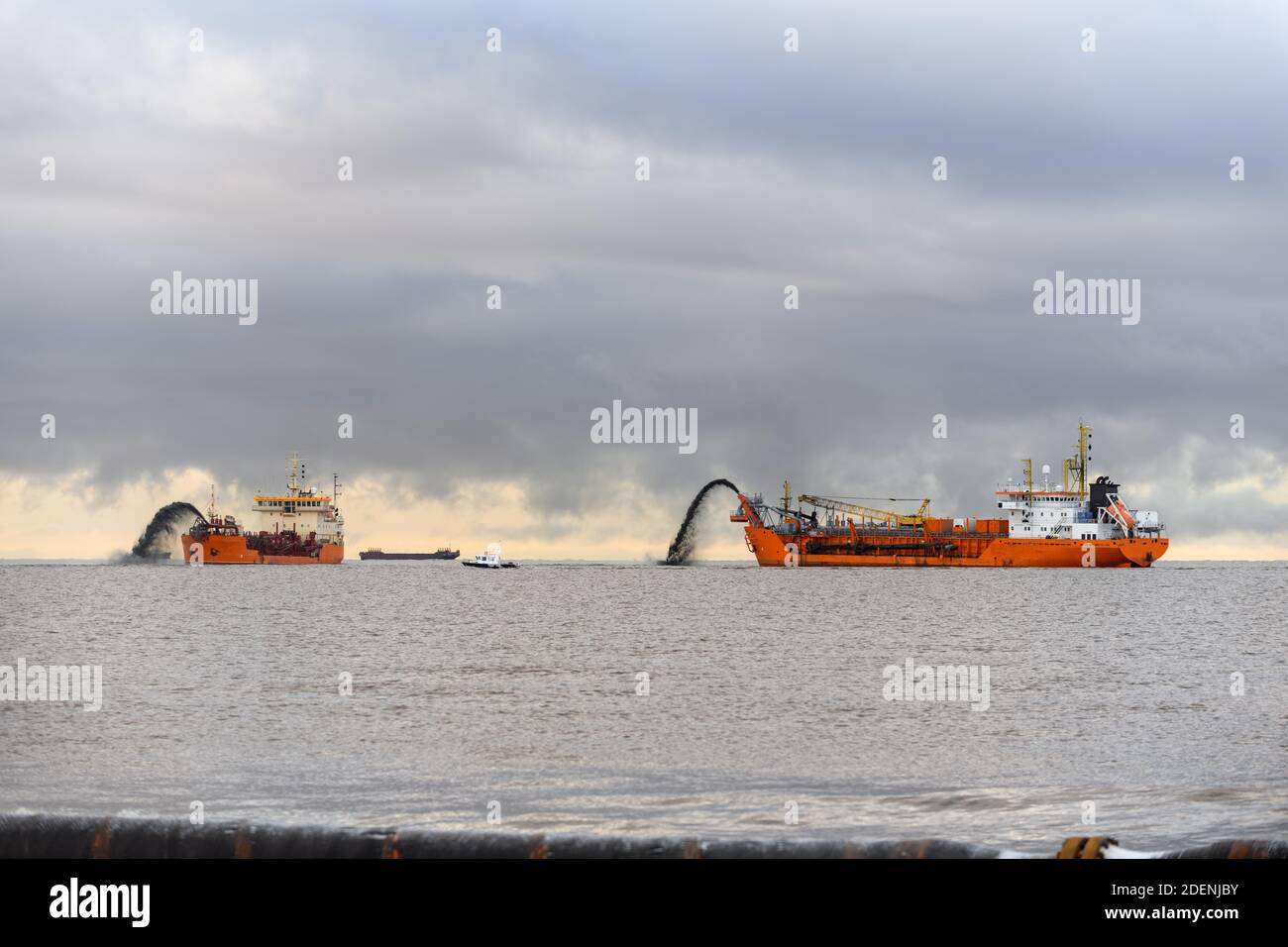 Two vessels engaged in dredging. Dredger working at sea. Ship ...