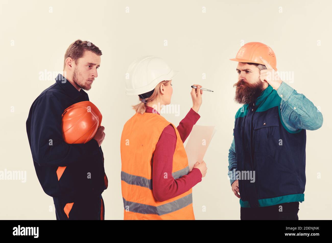 Labor dispute concept. Builders and engineer arguing, misunderstanding ...