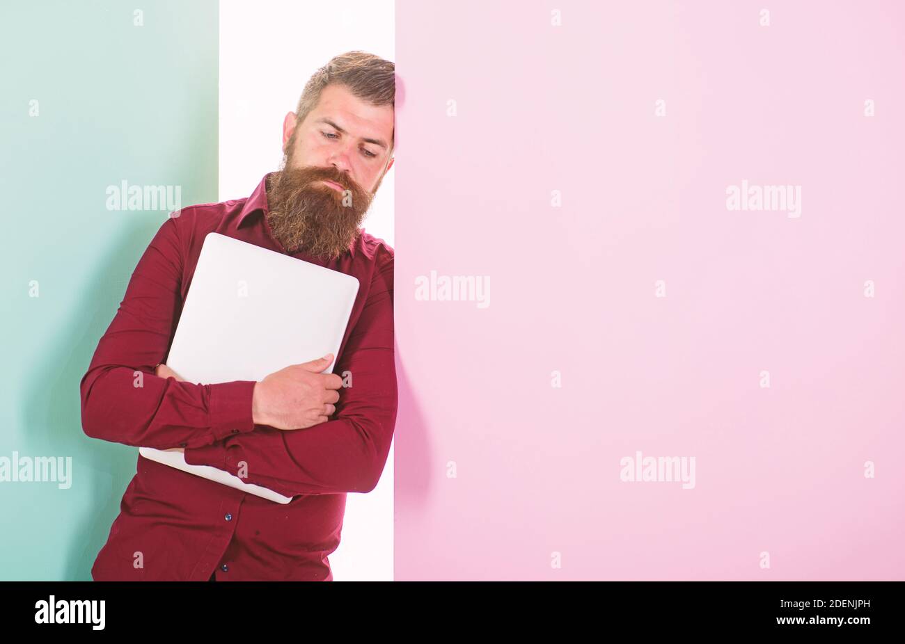 Fed up with creativity. Man bearded hipster worker with laptop lean on ...