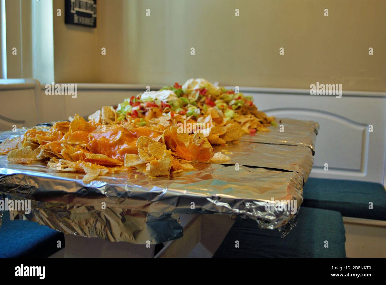Nacho table kitchen table wrapped in aluminum foil and covered with ...